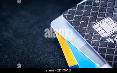 credit cards stack on dark color wooden table Stock Photo - Alamy