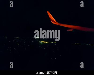 Flying over Spain Palma de Mallorca at night with view out of the ...