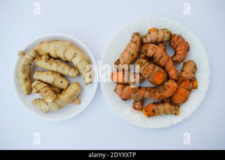 Many raw turmeric rhizomes as background, closeup Stock Photo - Alamy