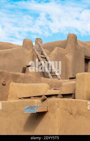 An adobe multistoried house in the Native American adobe village of ...