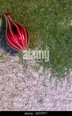 vertical image of Christmas tree with fallen pine needles shedding from ...
