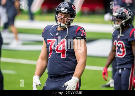 Cincinnati Bengals guard Max Scharping (74) holds a child following an ...