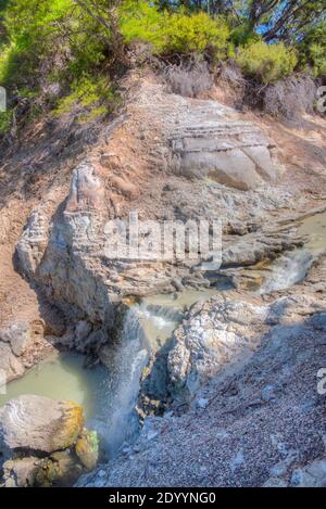 Lake Ngakoro Waterfall, Wai-o-Tapu geothermal park, New Zealand. White ...