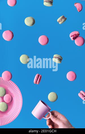 Hands with cup on color background Stock Photo - Alamy