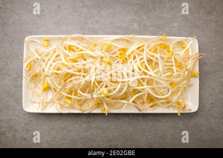 Yellow sprouts on white background Stock Photo - Alamy