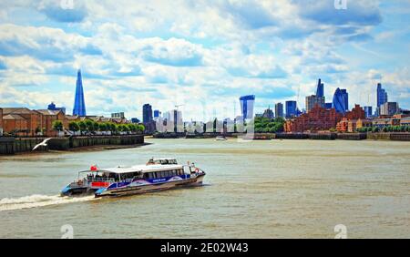 River bus floating Thames River,picturesque London skyline background ...