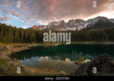 sunset on Carezza Lake in Trentino Alto Adige in Italy Stock Photo - Alamy