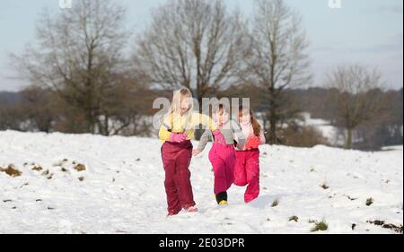 Ruby Millington (left) and Molly Chamberlain play in the snow at Tatton ...