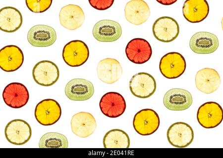 Pattern made of backlit different fruits slices on red background Stock ...