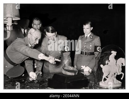 Adolf Hitler and Rudolf Hess visit the building of the Führer Buildings ...