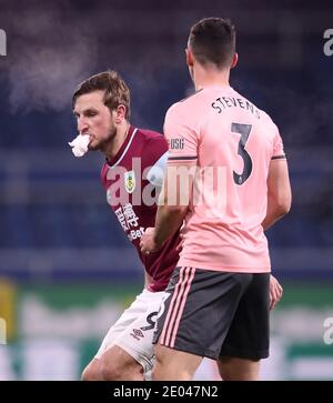Burnley's Chris Wood plays on with a cut lip during the Premier League ...