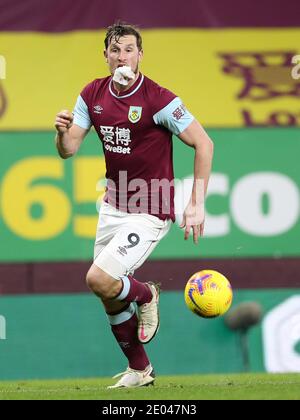Burnley's Chris Wood plays on with a cut lip during the Premier League ...