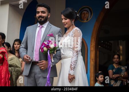 Kerala, India, 08-12-2017. Bride and groom arriving church, ready for ...