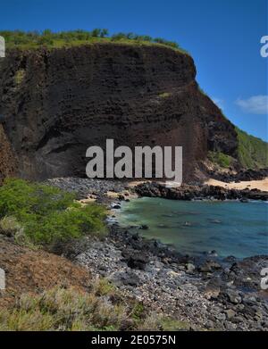 Eroding old volcano on a Moloka'i beach Stock Photo - Alamy