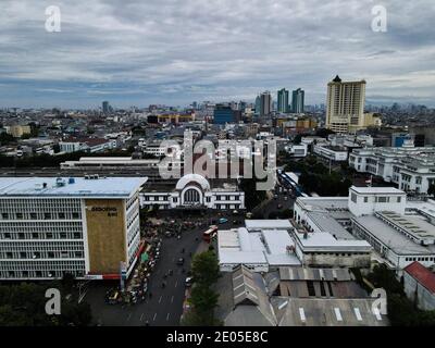 Aerial view of Jakarta Kota Train Station with Jakarta cityscape ...