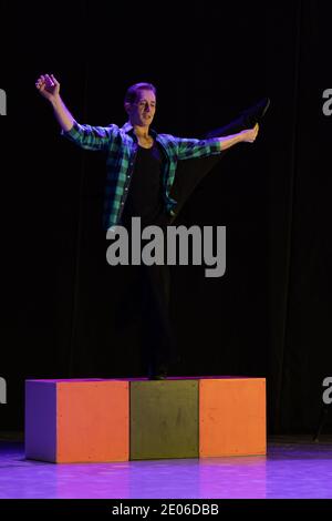 Actor dancer young man performs in the theater on stage in a dance ...