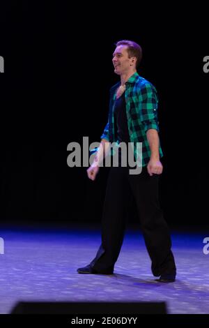 Actor dancer young man performs in the theater on stage in a dance ...