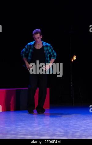 Actor dancer young man performs in the theater on stage in a dance ...