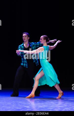 Team Actors dancers perform in the theater on stage in a retro musical ...