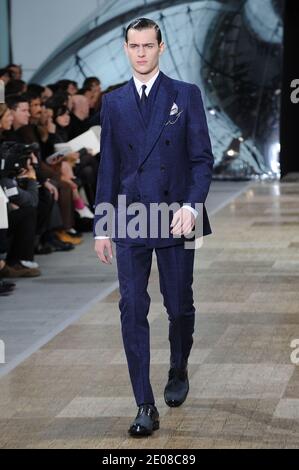 A model wears a creation as part of the Louis Vuitton men's Spring ...