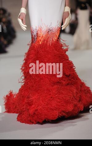 A model displays a creation by designer Stephane Rolland for his Spring ...