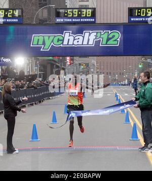 Peter Kirui of Kenya crosses the finish line and won the New York City ...
