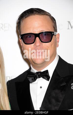 President of Yves Saint Laurent North America Brant Cryder and Mary ...