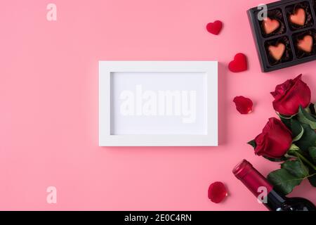 Valentine's Day memory with blank picture frame on pink background ...