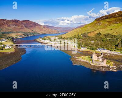 An aerial view of Eilean Donan Castle in the Scottish Highlands on a ...