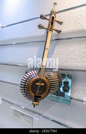 A bowed string instrument called kamancheh also kamanche or kamancha ...