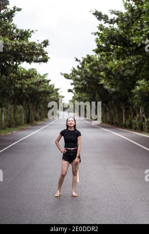 Asphalt road among green trees Stock Photo - Alamy