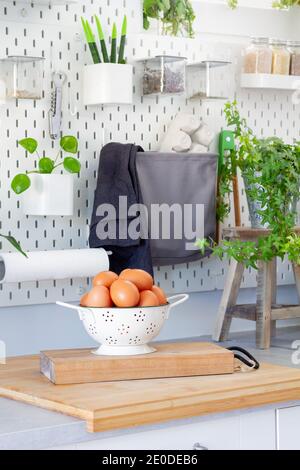 Chicken eggs in colander on table Stock Photo - Alamy