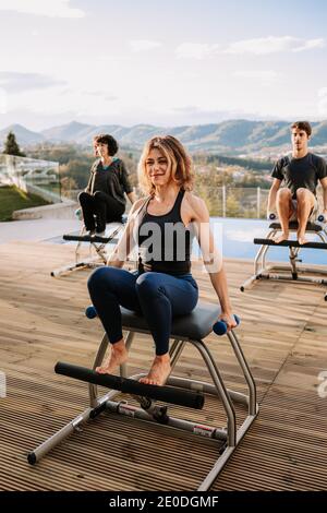 Sporty people practicing pilates at group class Stock Photo - Alamy