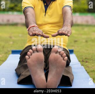 Fitness, yoga and old man with stretching in class for physical ...
