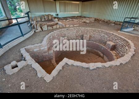 Kiva (ceremonial chamber) with megaliths in background at Megalithic ...
