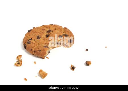 Bitten off chocolate, crumbled homemade cookies on a white background ...
