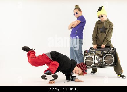 group of cheerful kids dancing breakdance, hip hop dance group with ...