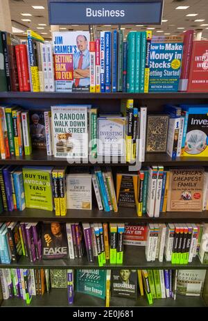 rows of business books on a bookshelf in a bookstore Stock Photo - Alamy