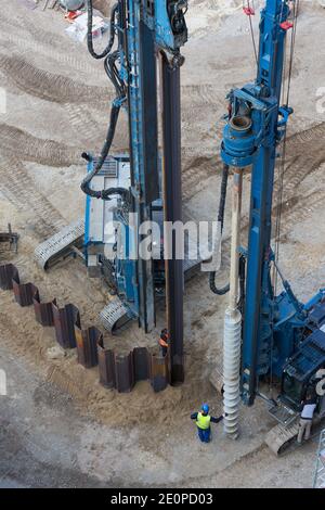 installing sheet piling on construction site with drilling rig Stock ...