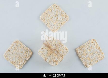 Stack of delicious airy crispbread on white background Stock Photo - Alamy