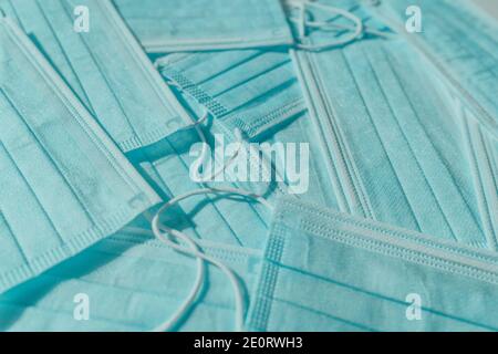 Top view new preventive mask on laptop and eye glasses on blue ...