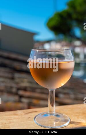 Drinking of local cold rose wine on balcony in summer Provence, Var ...