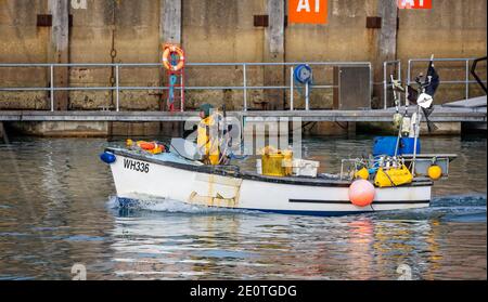 Small boat returning to Weymouth Harbour,Dorset,UK Stock Photo - Alamy