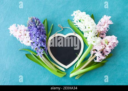 Pink hyacinth flowers with heart shape on marble background, spring ...