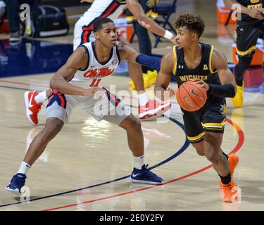 Mississippi guard Matthew Murrell (11) is defended by Georgia guard De ...