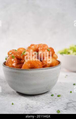 Fried crispy shrimp appetizer, selective focus. On a black background ...