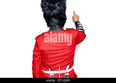 Middle age handsome wales guard man wearing traditional uniform over ...