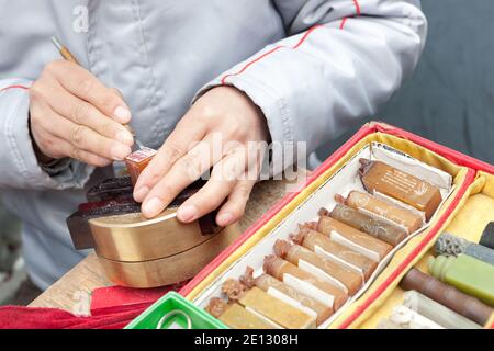 Beijing, China : Hands carving traditional stone name chops (name seals ...