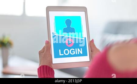 Tablet screen displaying a login concept Stock Photo - Alamy
