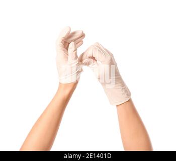 Woman taking off protective gloves on white background Stock Photo - Alamy